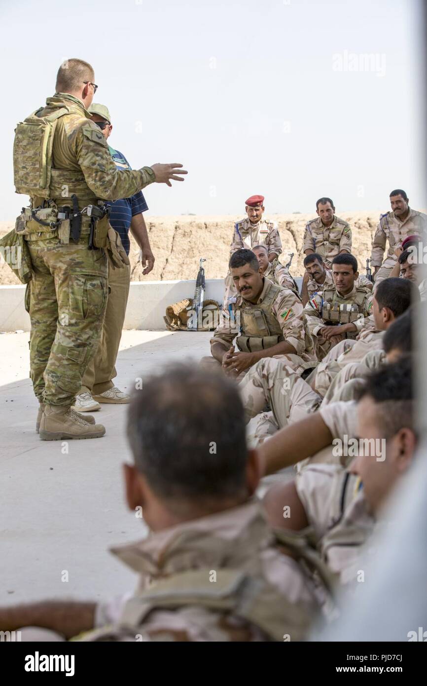 army Cpl. Nathaniel Taylor, with Task Group Taji, conducts a lesson on ...