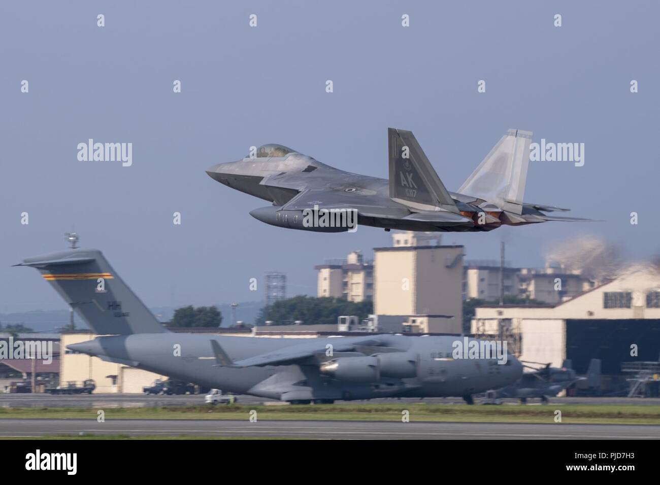 An F-22 Raptor from Joint Base Elmendorf-Richardson, Alaska takes off ...