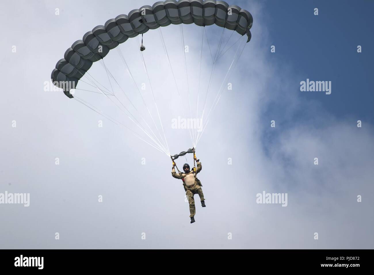A Pararescueman from the 38th Rescue Squadron, descends after ...