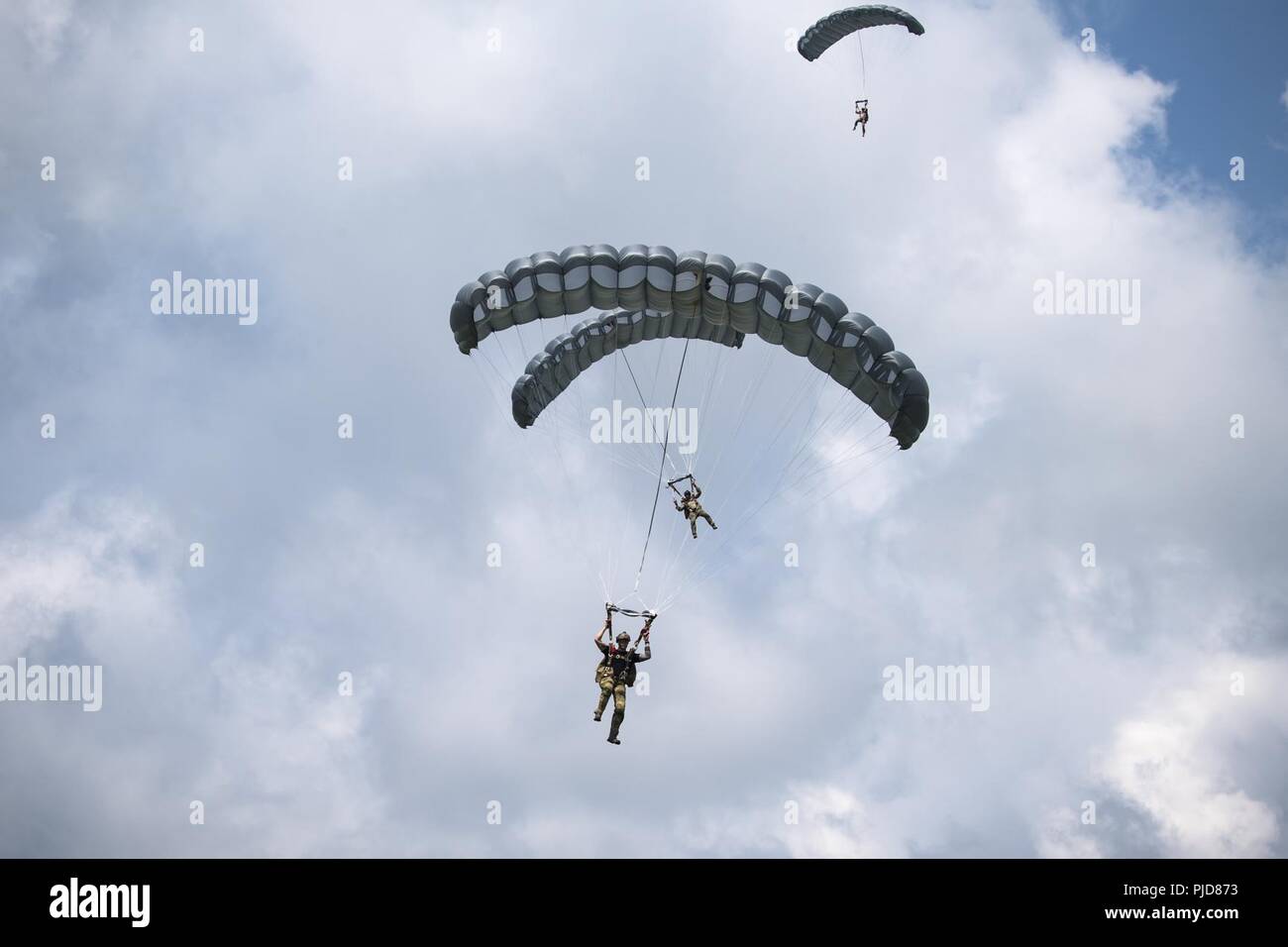 Pararescuemen (PJ) from the 38th Rescue Squadron (RQS), descend after ...