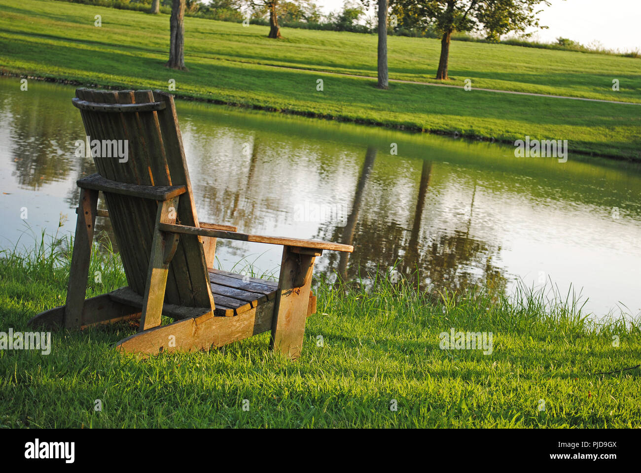 Empty chair by the water Stock Photo - Alamy
