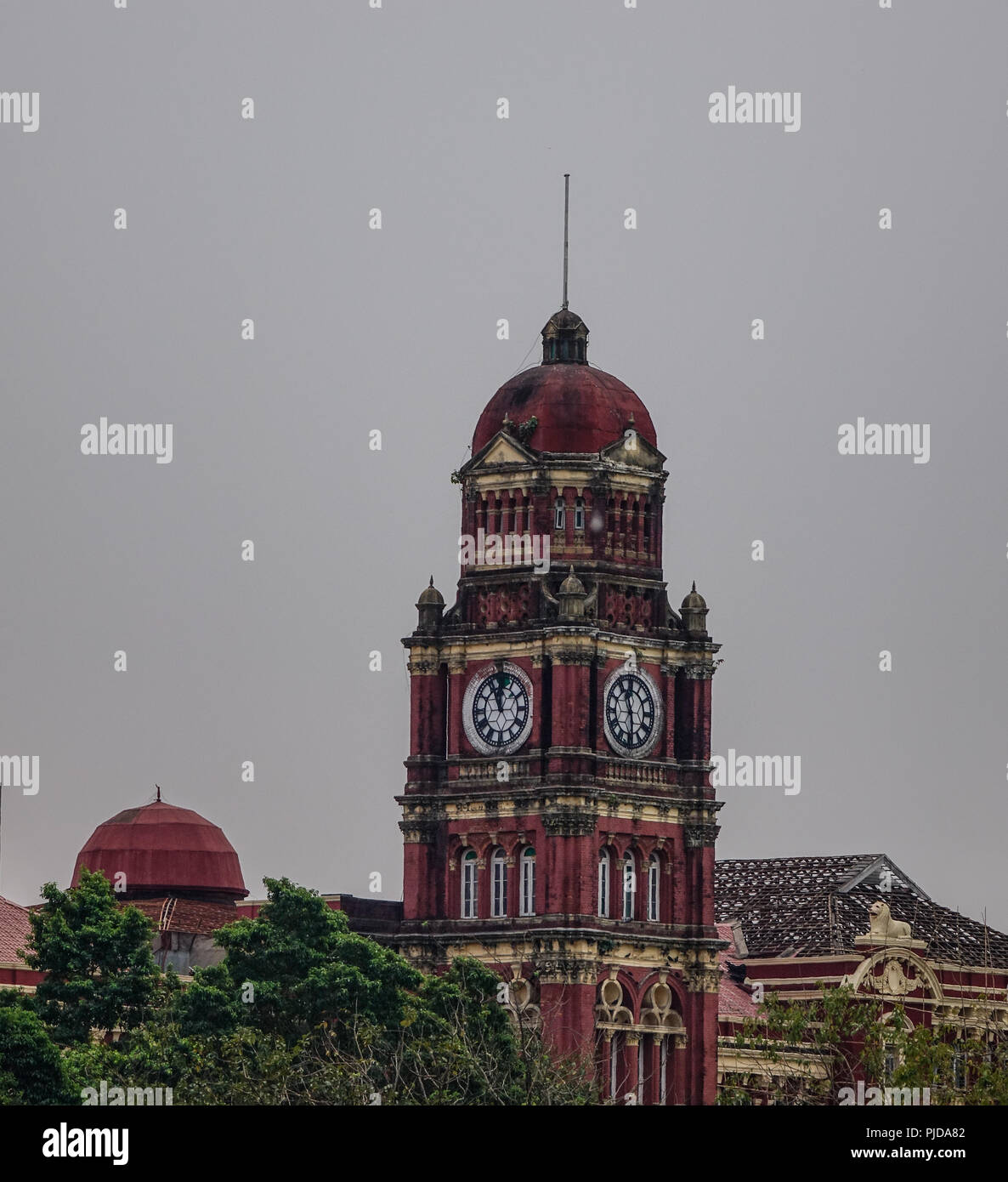 Clock tower of ancient British-style building in Yangon, Myanmar Stock ...
