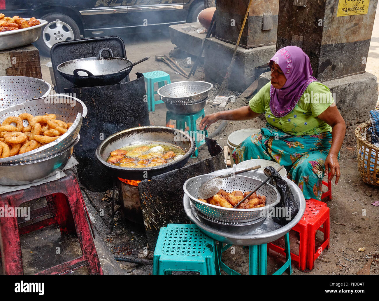 Yangon, Myanmar - Feb 26, 2016. Selling street food in Yangon, Myanmar ...