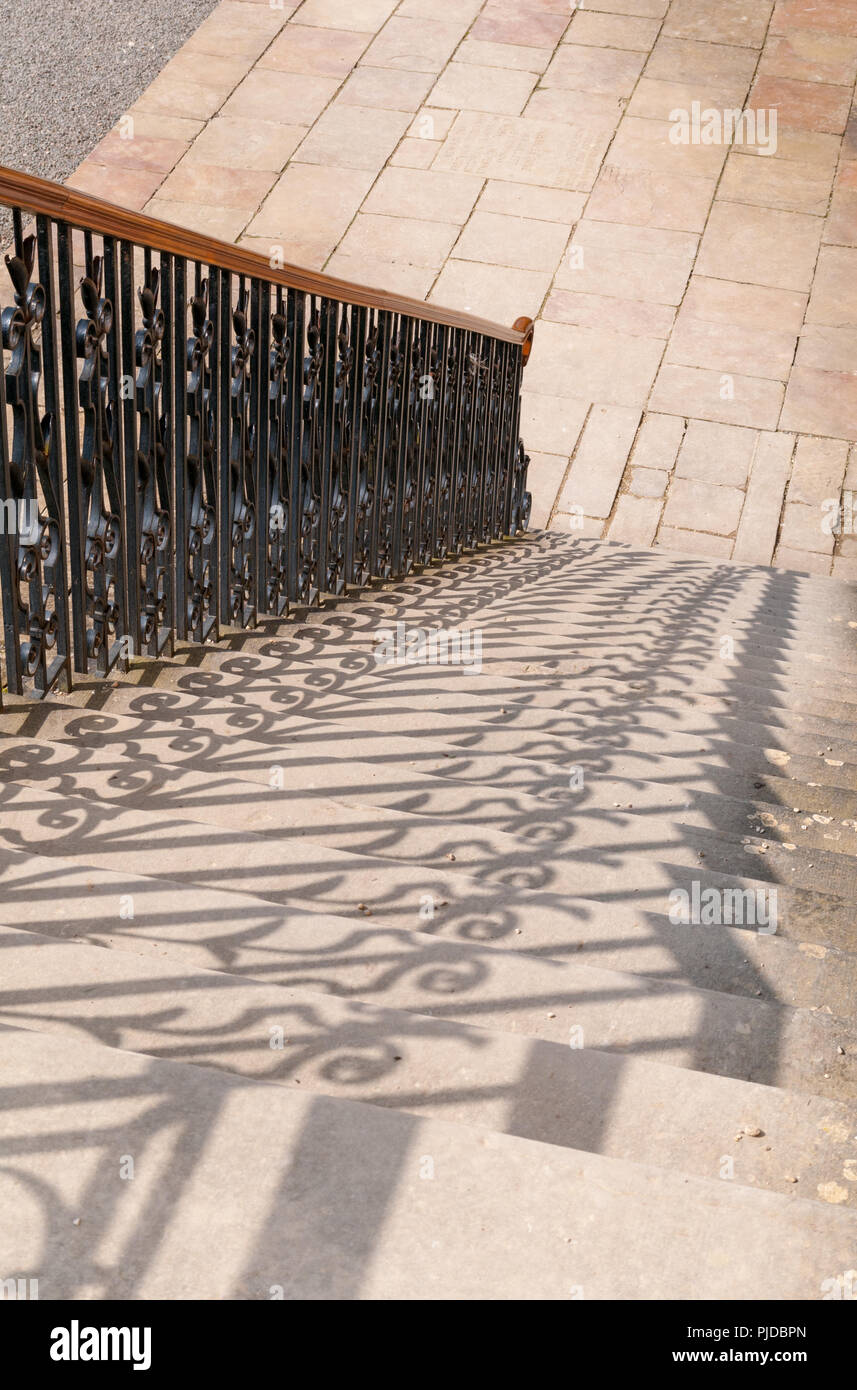 Shadows of decorative cast metal balusters on stone steps Stock Photo ...