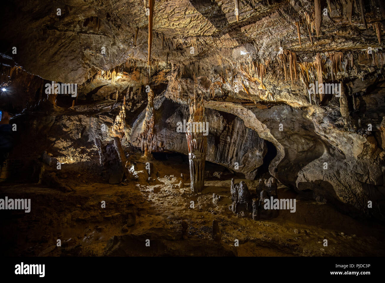 Close up of big stalactite and stalagmite. Inside cave scene Stock ...