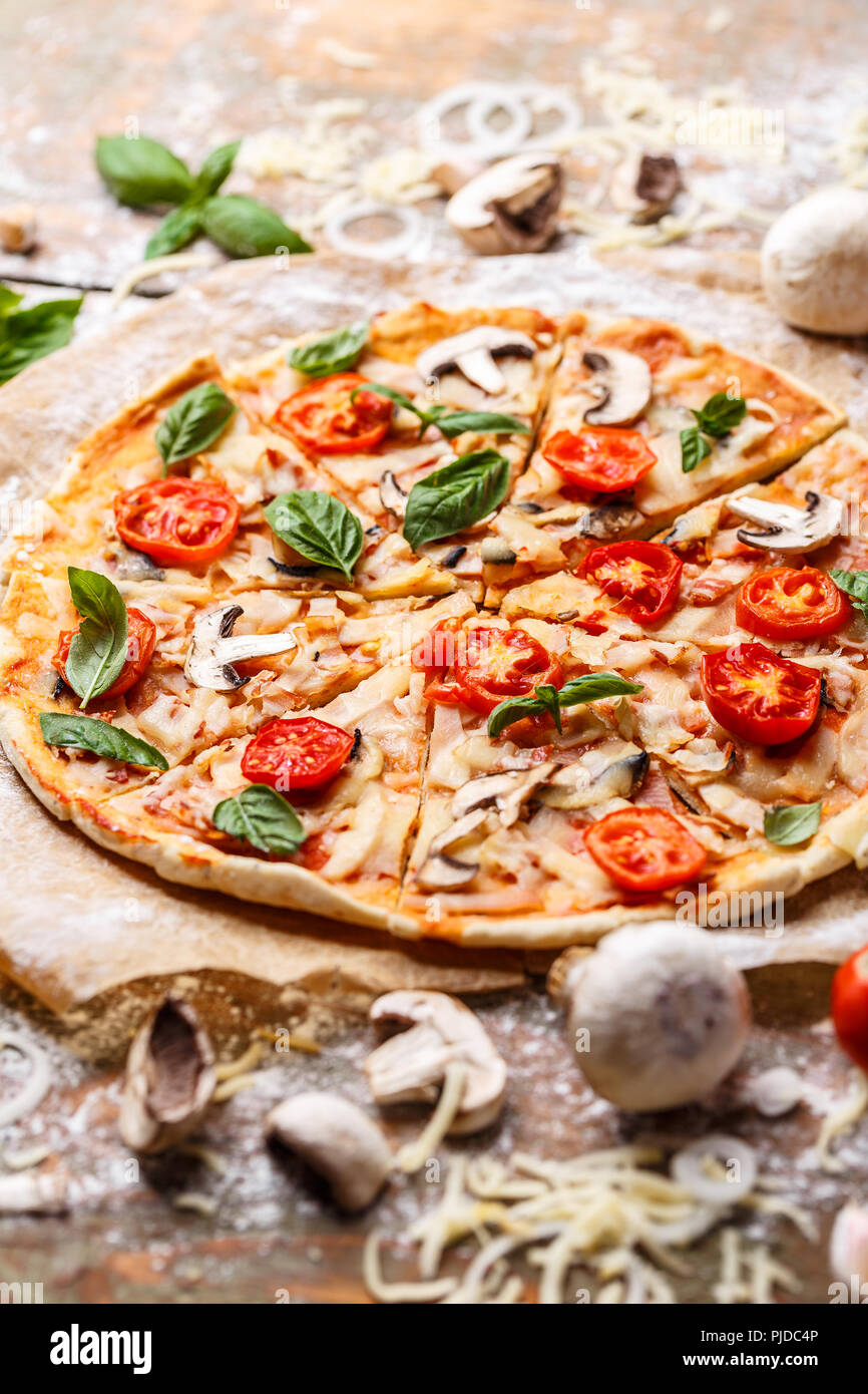 Fresh Italian pizza with mushrooms tomatoes and cheese,close up Stock ...
