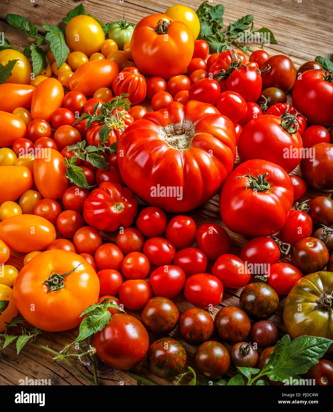 Organic assorted tomatoes background hi-res stock photography and ...
