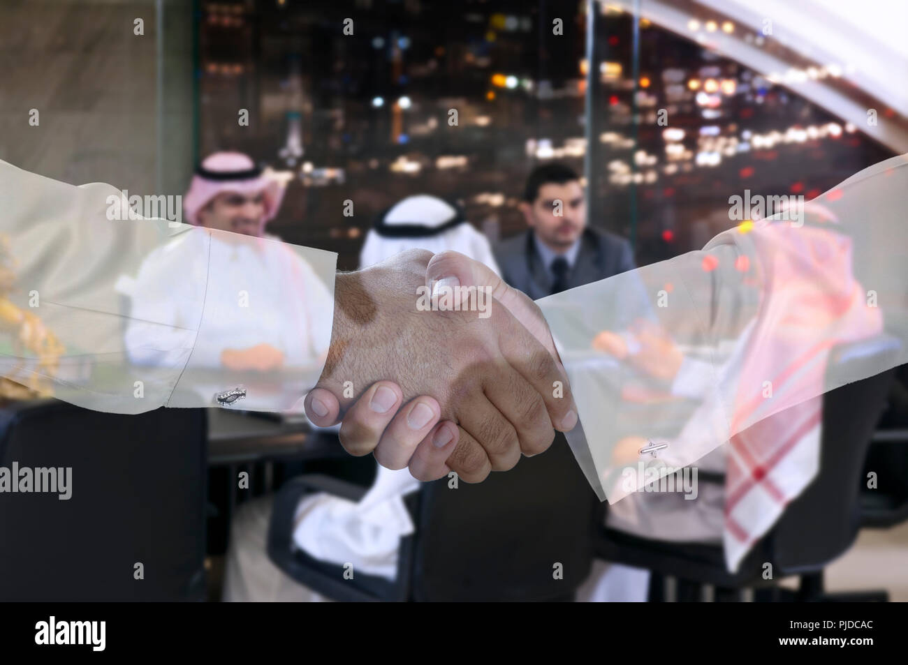 Handshake multi exposure with Saudi Arab businessmen meeting in the ...