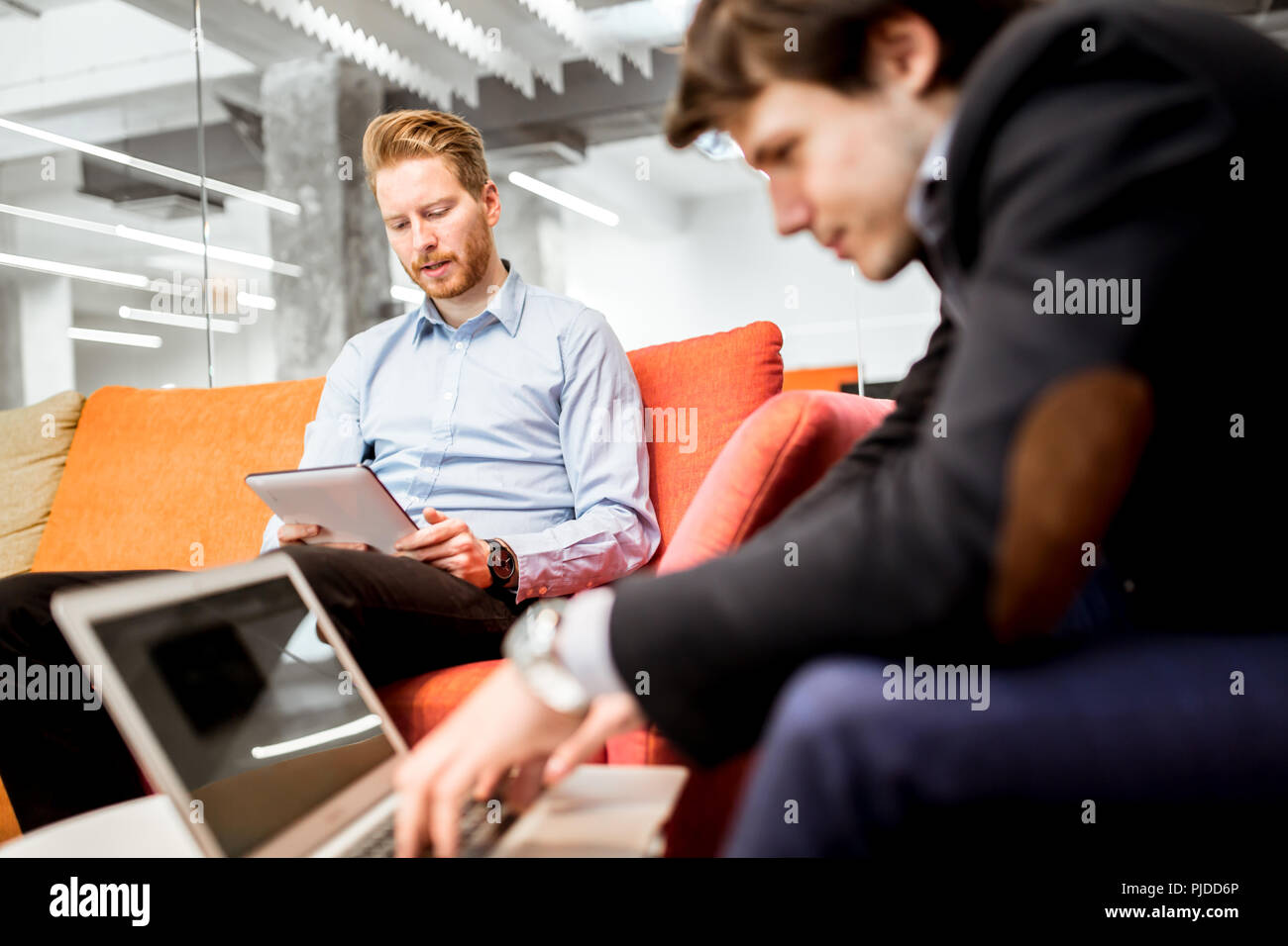 Business colleagues resting during break Stock Photo - Alamy