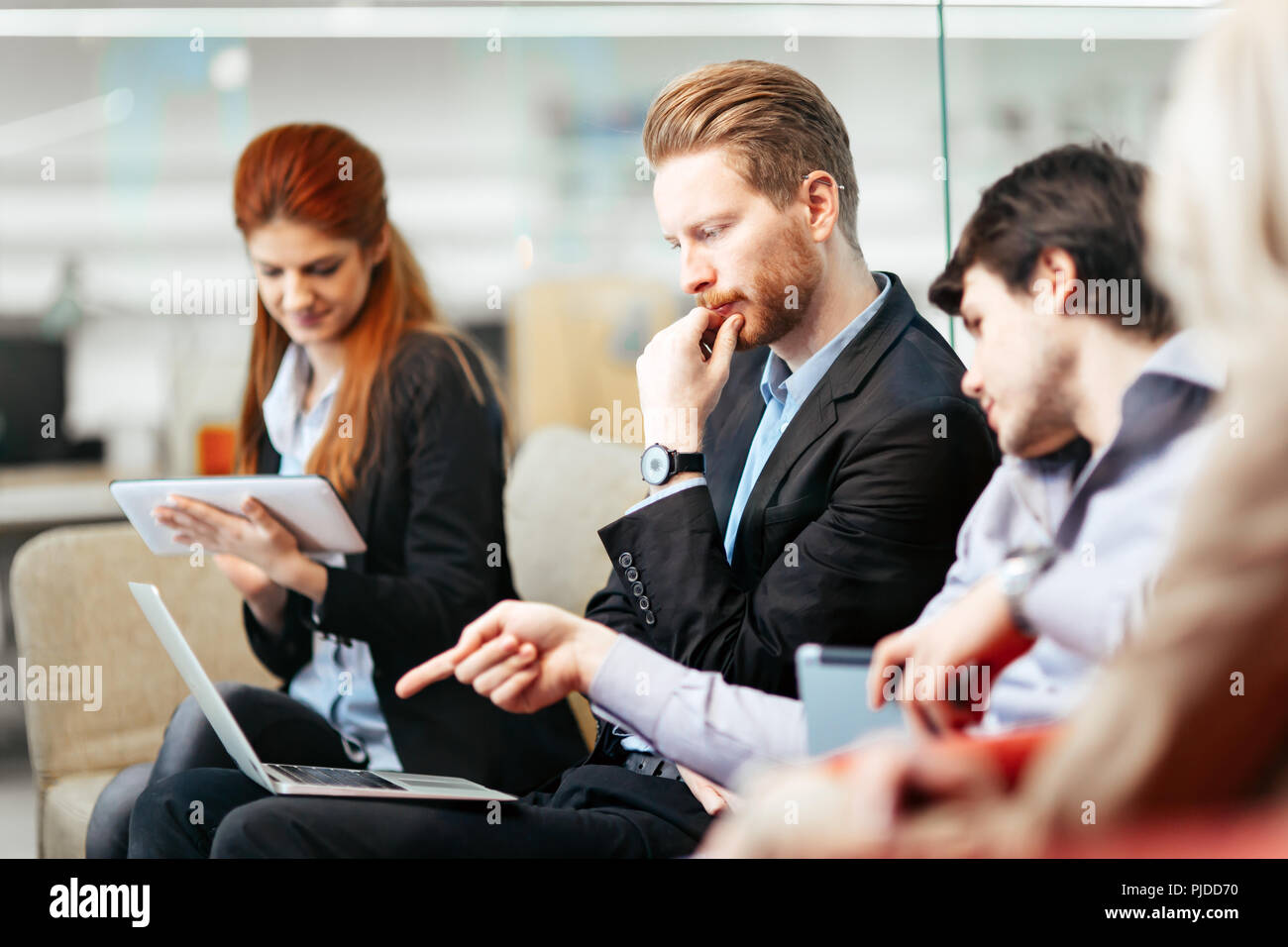 Business people conversation. Technology at hand Stock Photo - Alamy