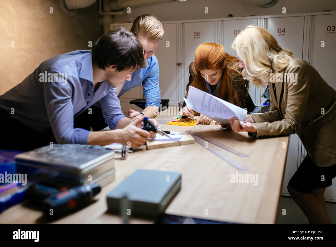 Team working on project together Stock Photo - Alamy