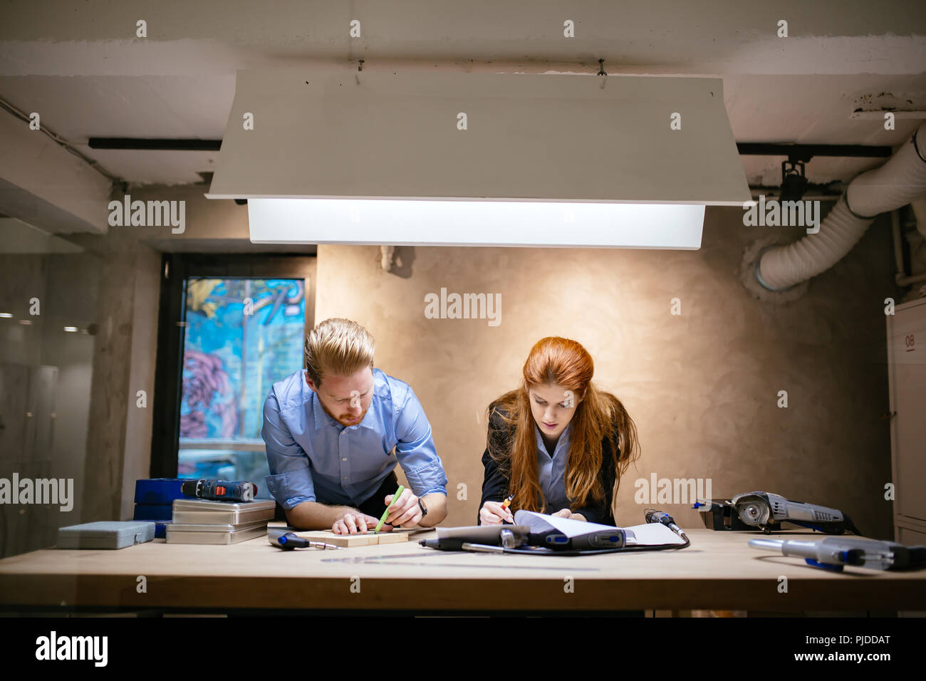 People working in modern beautiful workshop Stock Photo - Alamy
