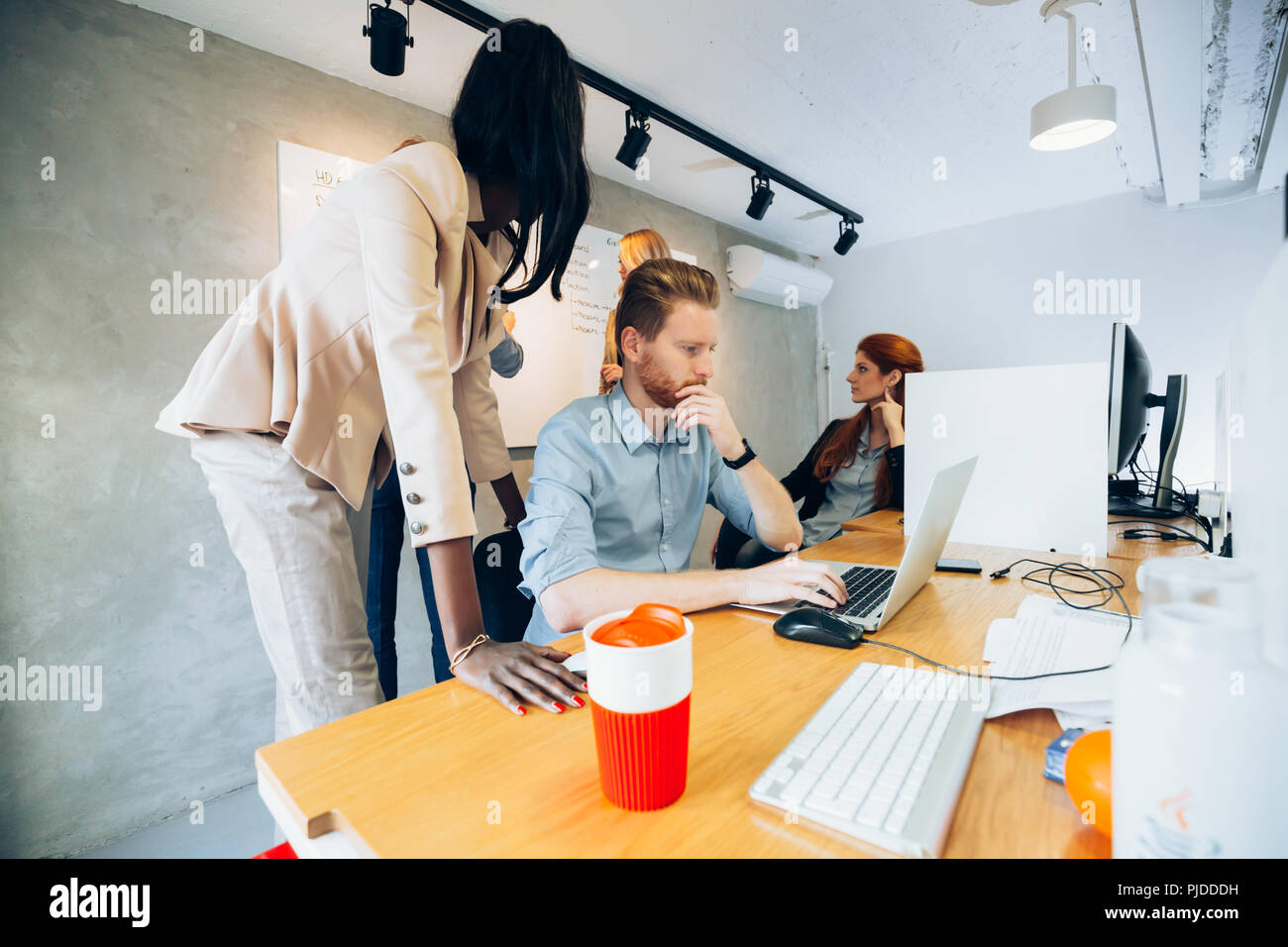 Business people collaborating in office Stock Photo - Alamy