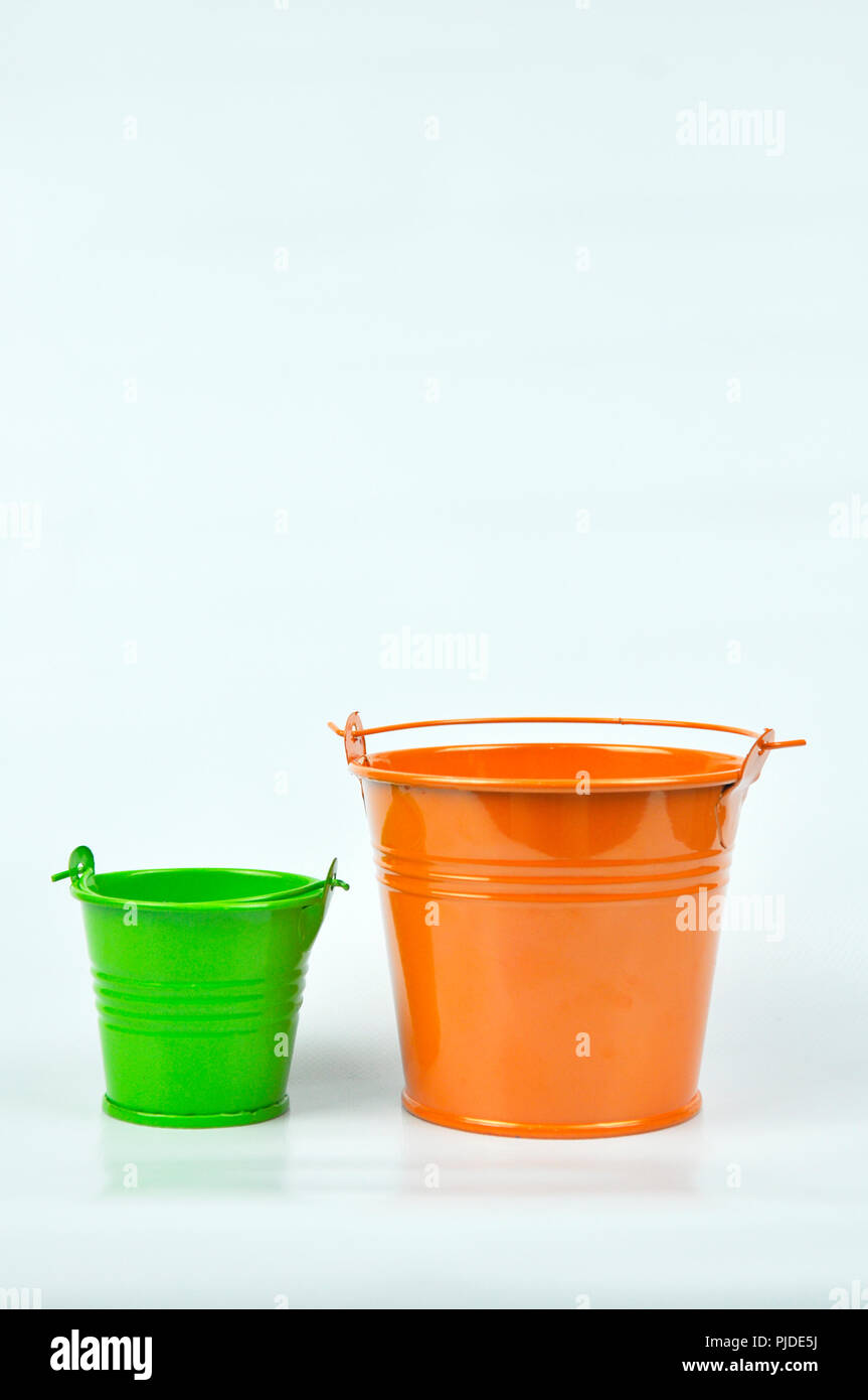 Small orange and green buckets isolated on white background Stock Photo ...