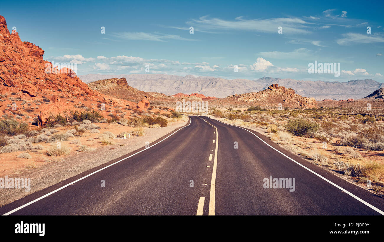 Retro stylized picture of a desert road, travel concept Stock Photo - Alamy