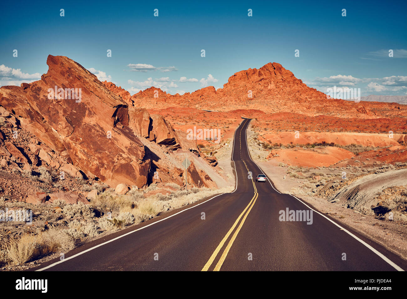 Retro stylized picture of a scenic desert road, travel concept Stock ...