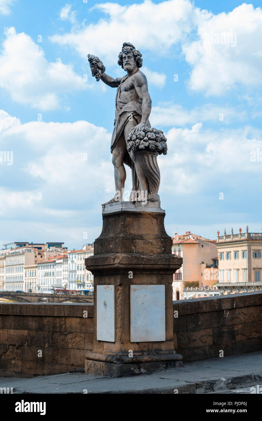 Statue of Bacchus in Holy Trinity Bridge of Florence, Italy Stock Photo ...
