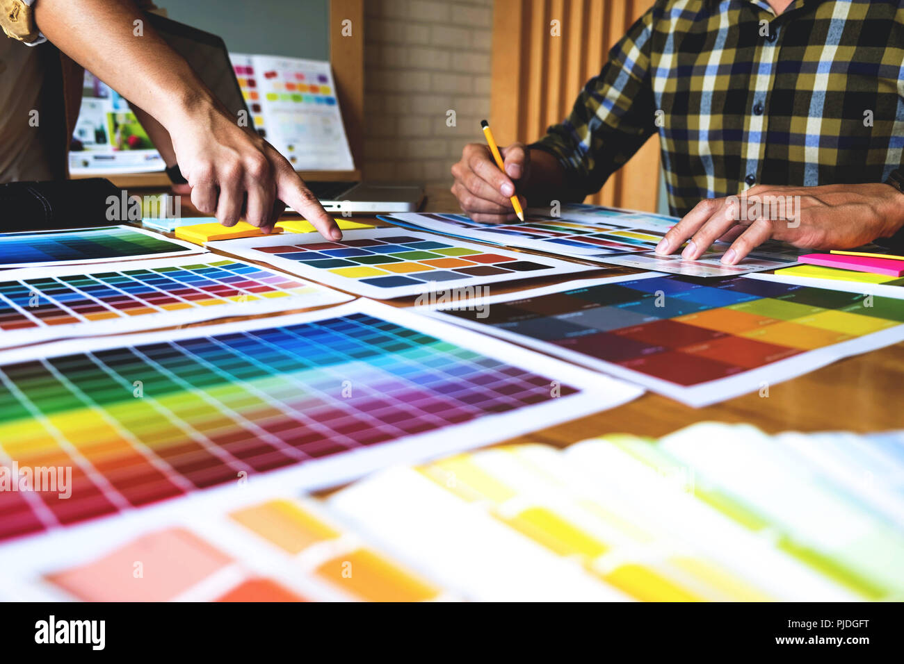 Graphic designers choose colors from the color bands samples for design ...