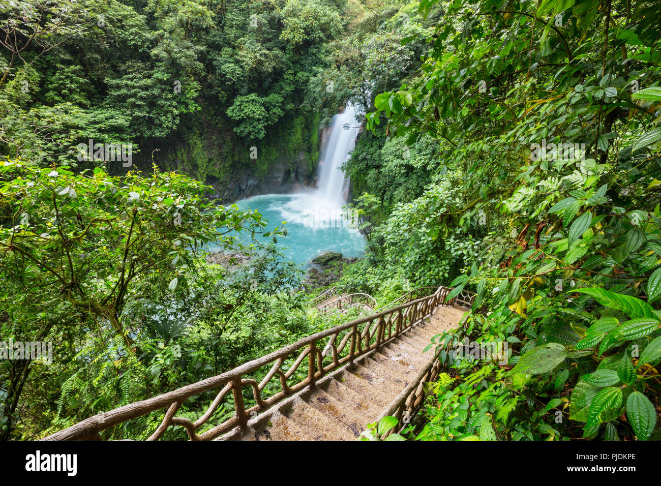 Majestic waterfall in the rainforest jungle of Costa Rica. Tropical ...