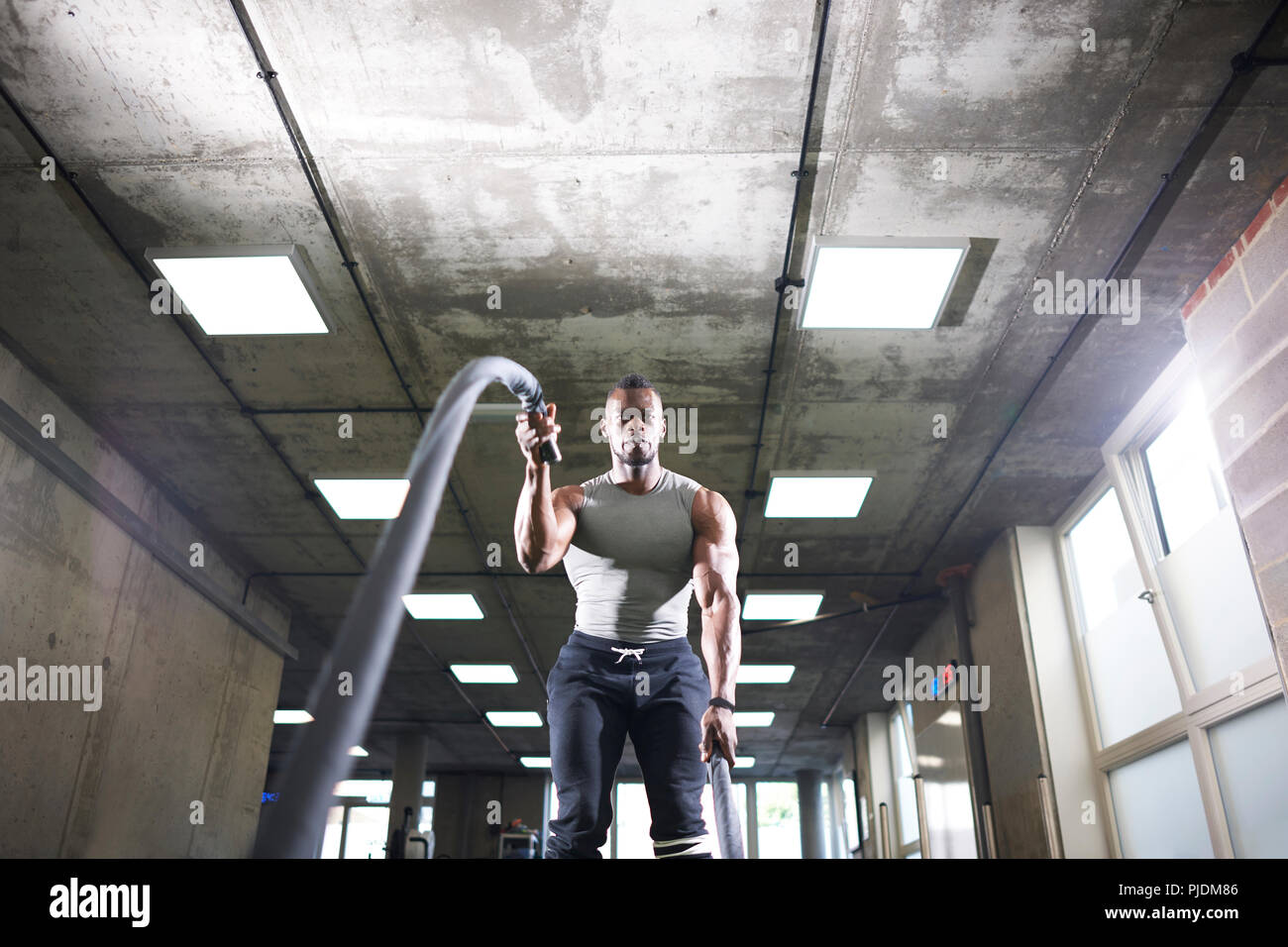 Exercising battle ropes person in hi-res stock photography and images ...