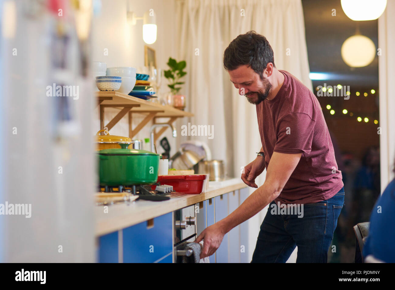 Man cooking in kitchen hi-res stock photography and images - Alamy