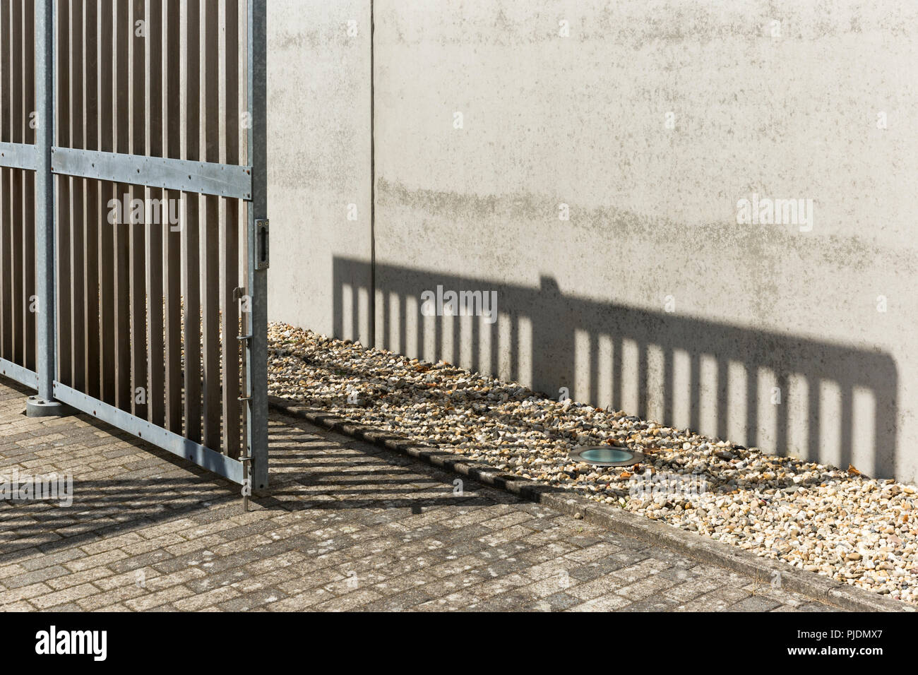 A factory gate opened to the warehouse floor Stock Photo - Alamy