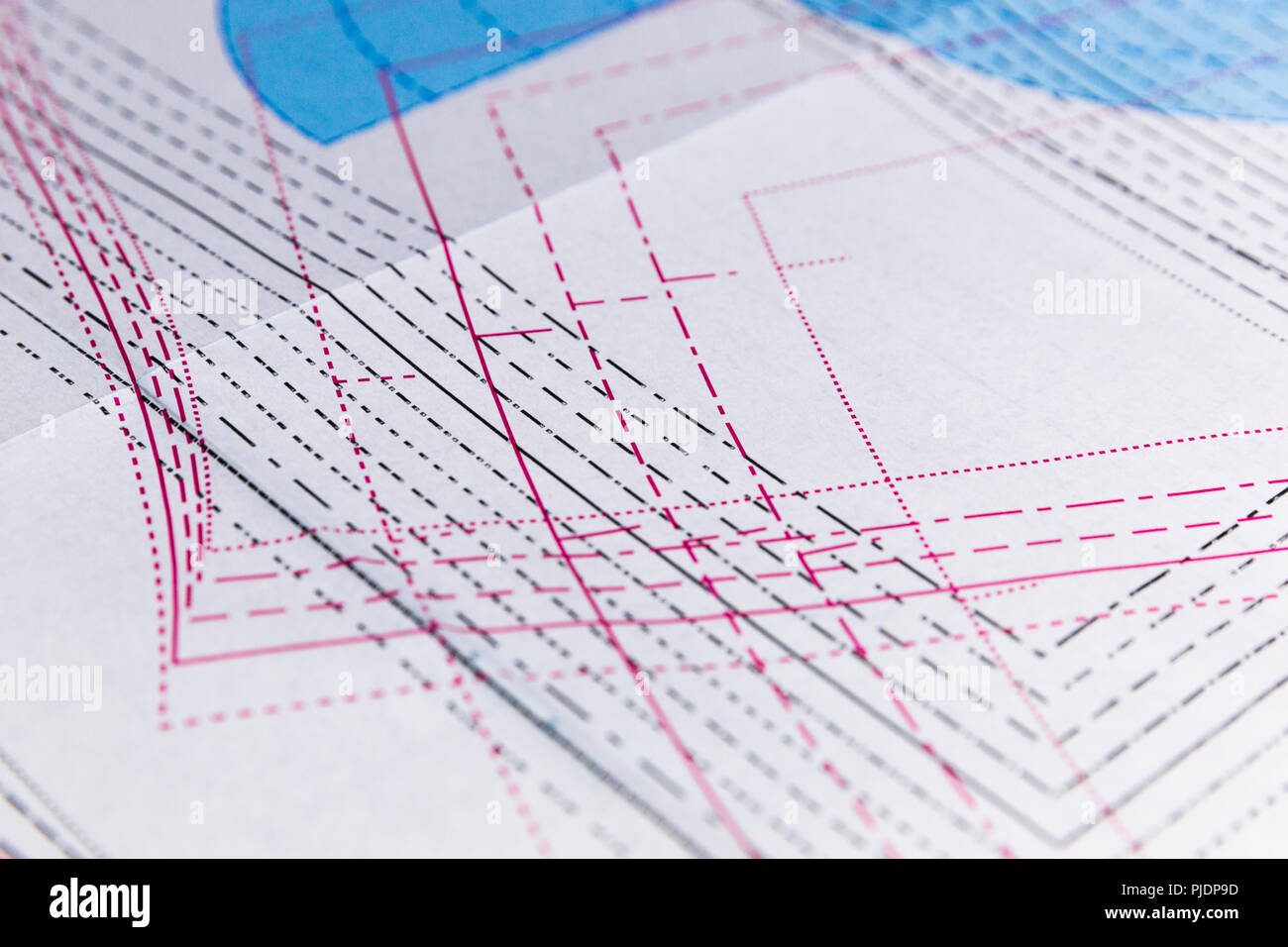 Detailed view of fabric pattern guide laid out on the table Stock Photo ...