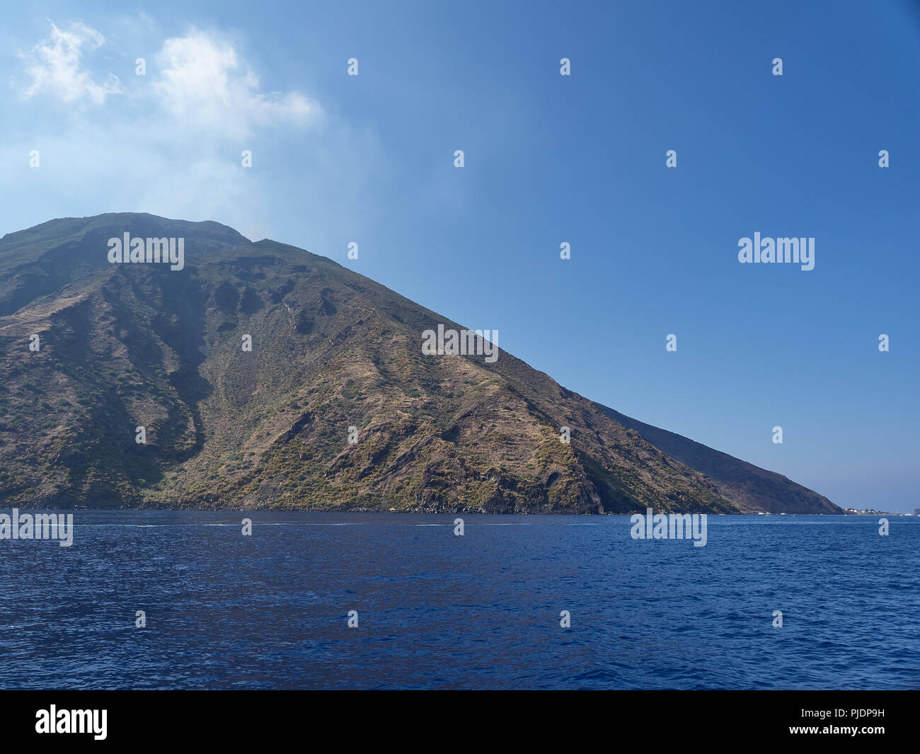 View of Stromboli island and volcano from the boat in a summer ...