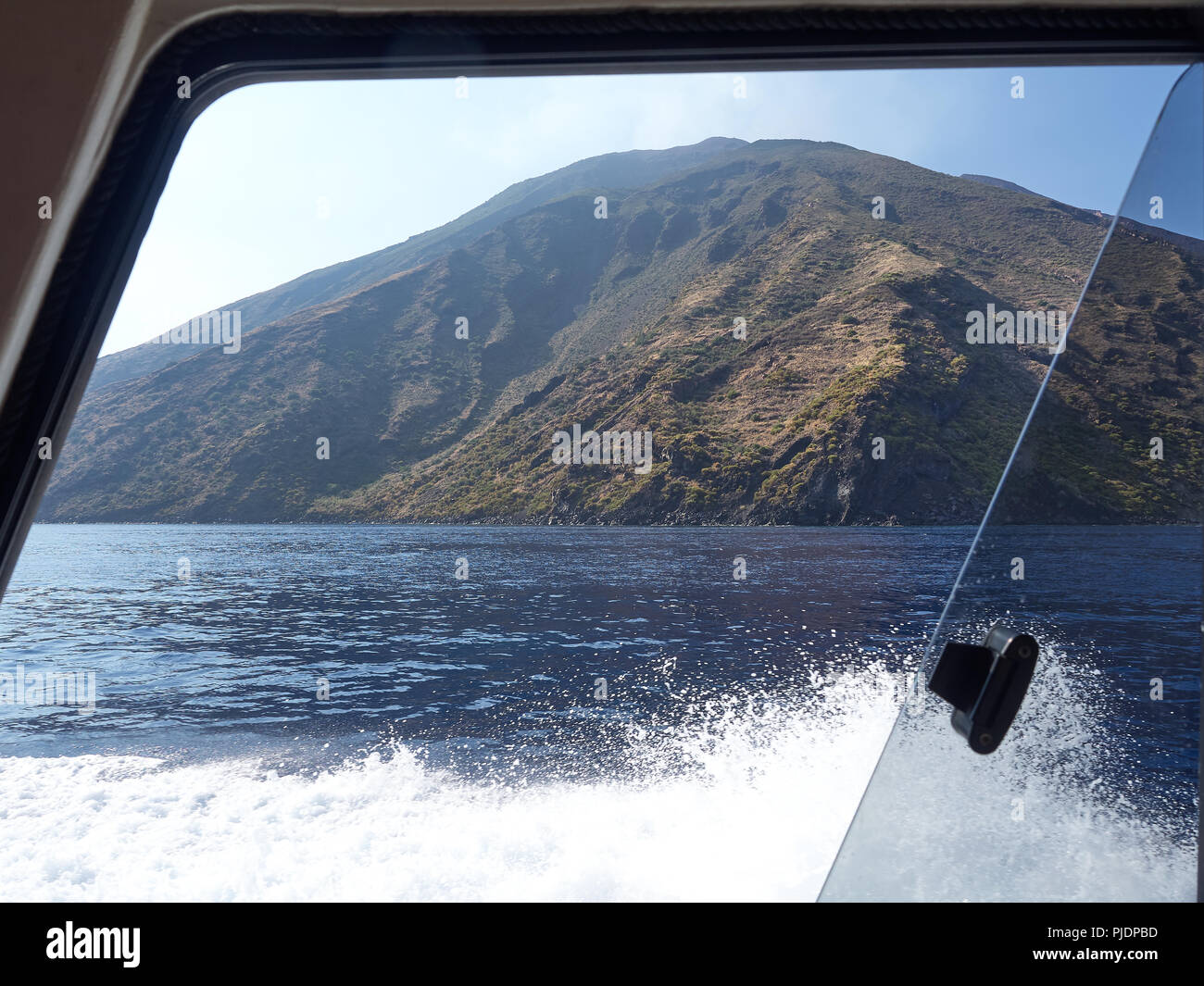 View of Stromboli island and volcano from the boat in a summer ...