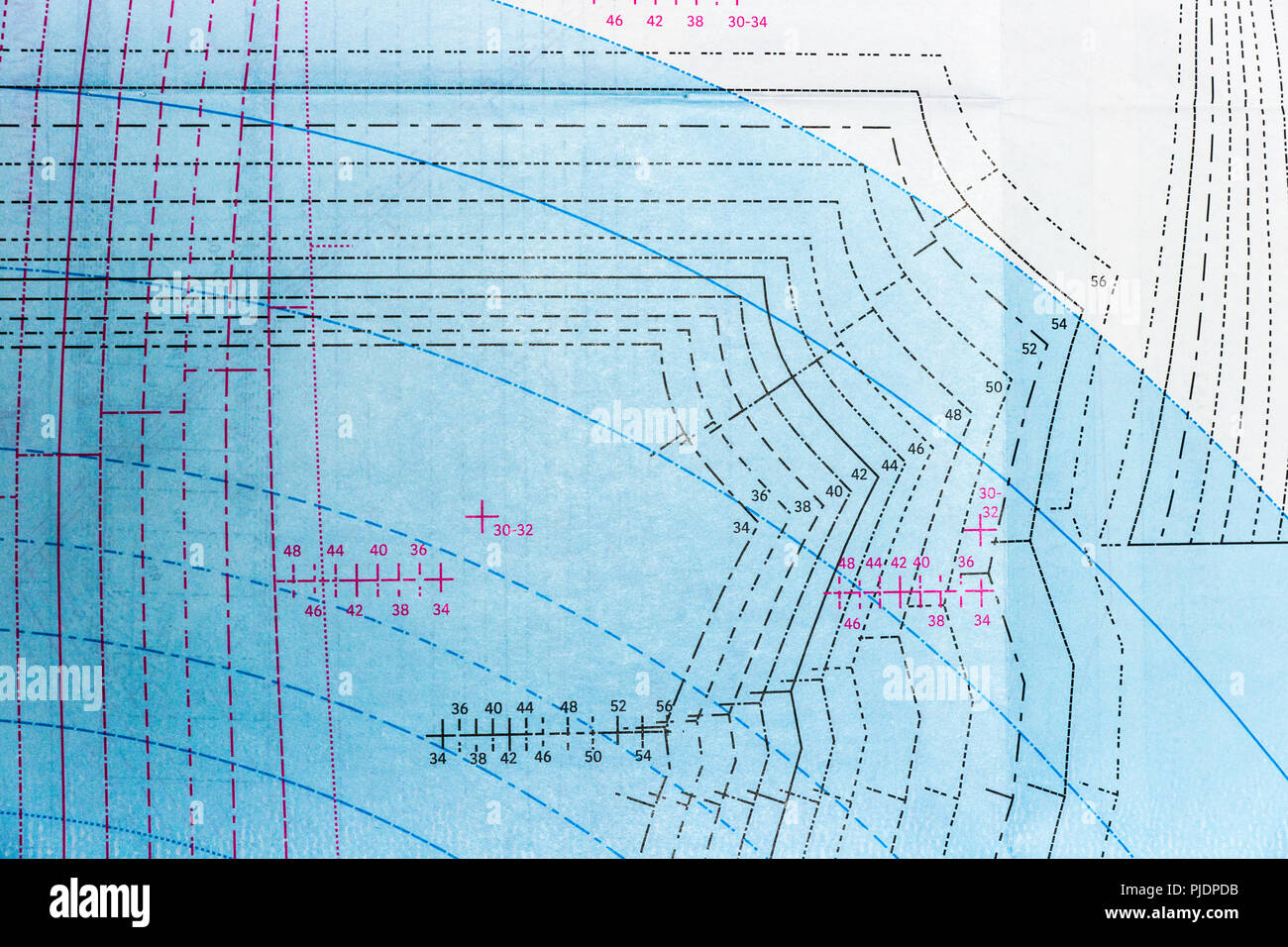 Tiny lines etching into detailed paper guide Stock Photo - Alamy
