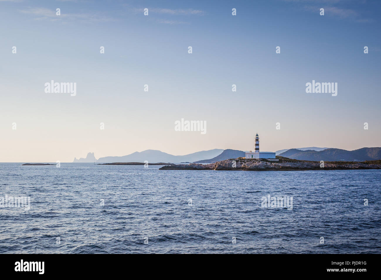 Beautiful view of the silhouette of Ibiza lighthouse taken from the sea ...
