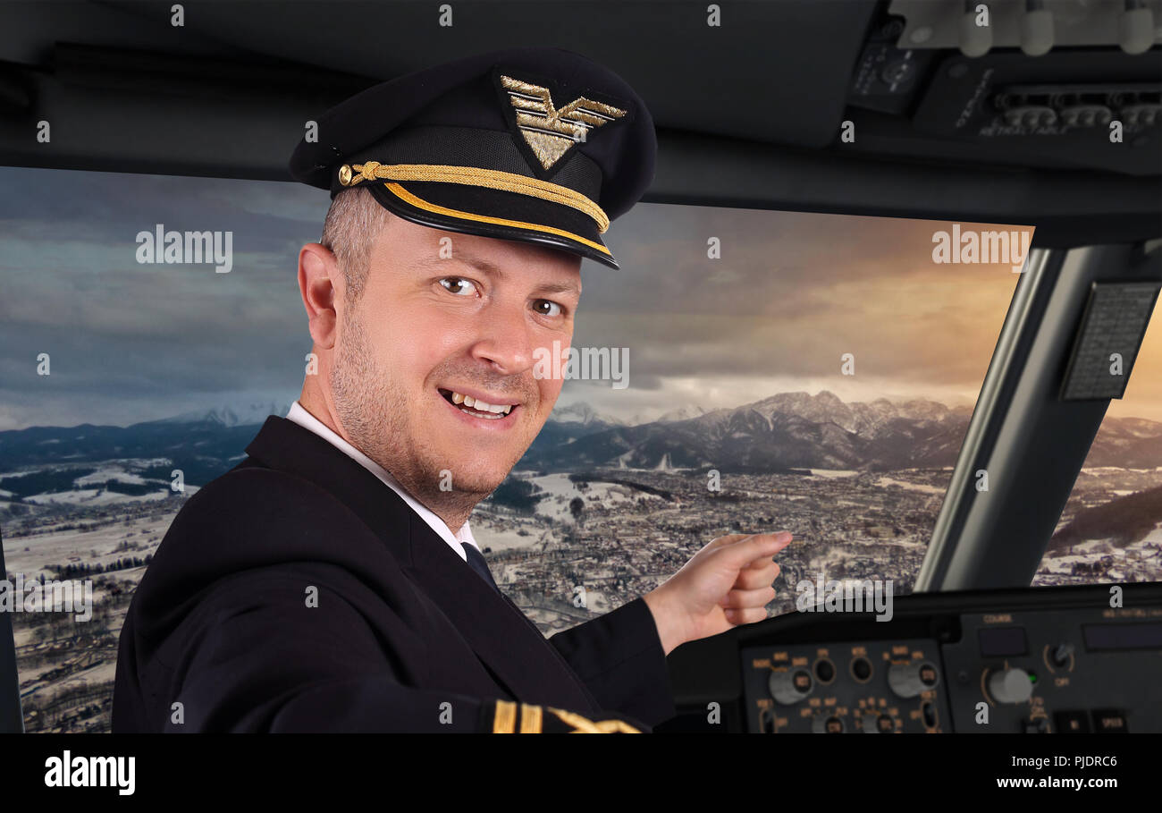 Happy pilot in cockpit Stock Photo - Alamy