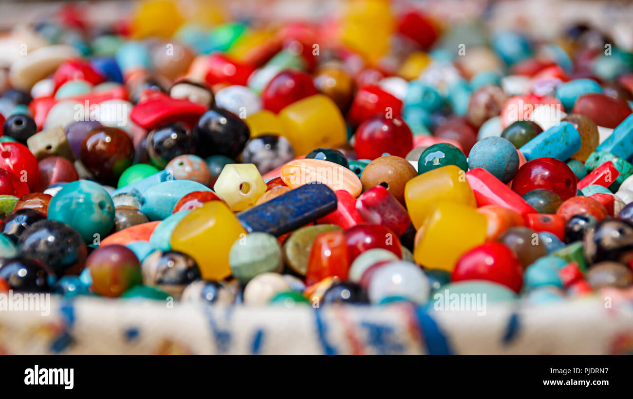 Beads from multi-colored semiprecious stones of different shapes Stock ...
