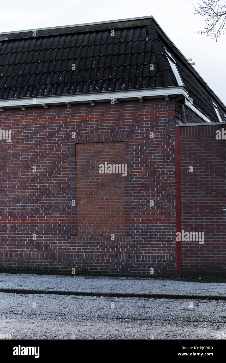 Brick window filled in with more bricks Stock Photo - Alamy