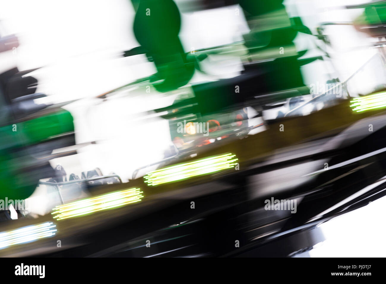 Carnival ride in full high speed motion Stock Photo - Alamy