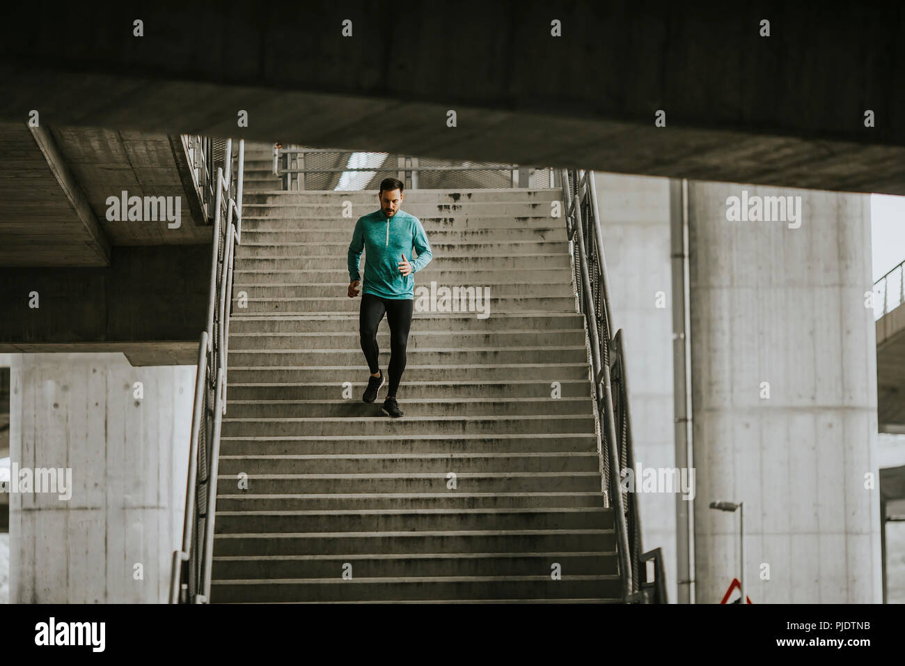 Fitness man running down stairs hi-res stock photography and images - Alamy