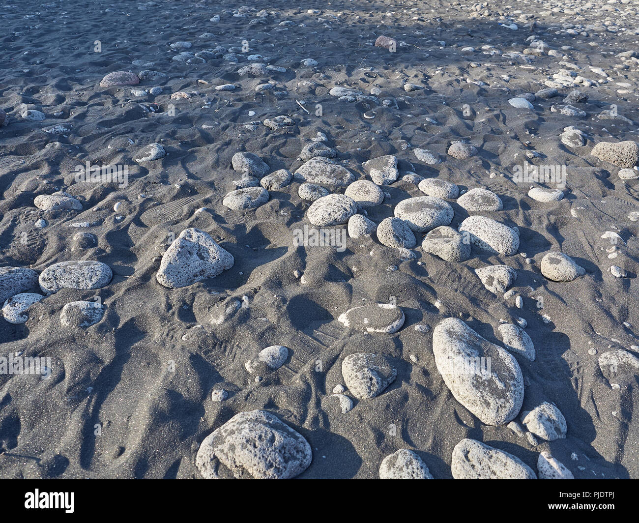 Black volcano rocks dued to volcano eruptions Stock Photo - Alamy