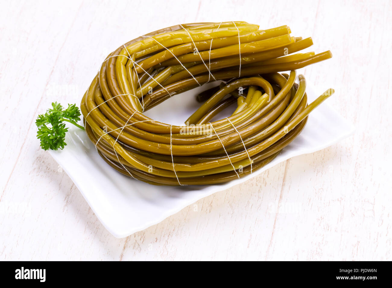 Pickled ramsons heap in the bowl Stock Photo - Alamy