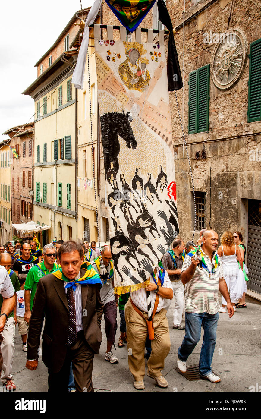 Members Of The Winning Bruco (Caterpillar) Contrada Parade Their Prize ...