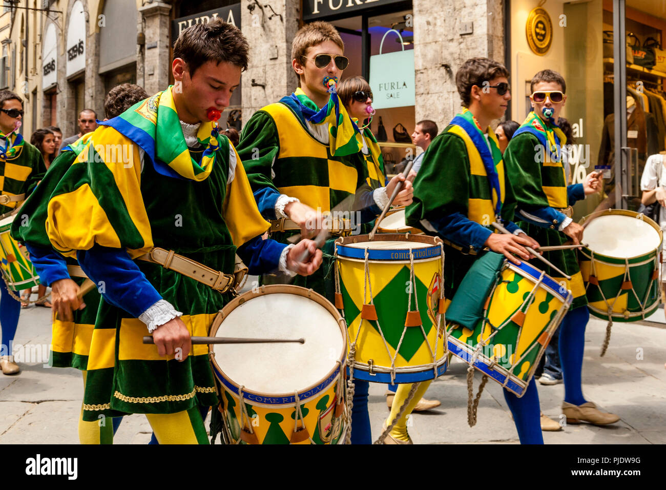 Members Of The Bruco (Caterpillar) Contrada Take Part In A Procession ...