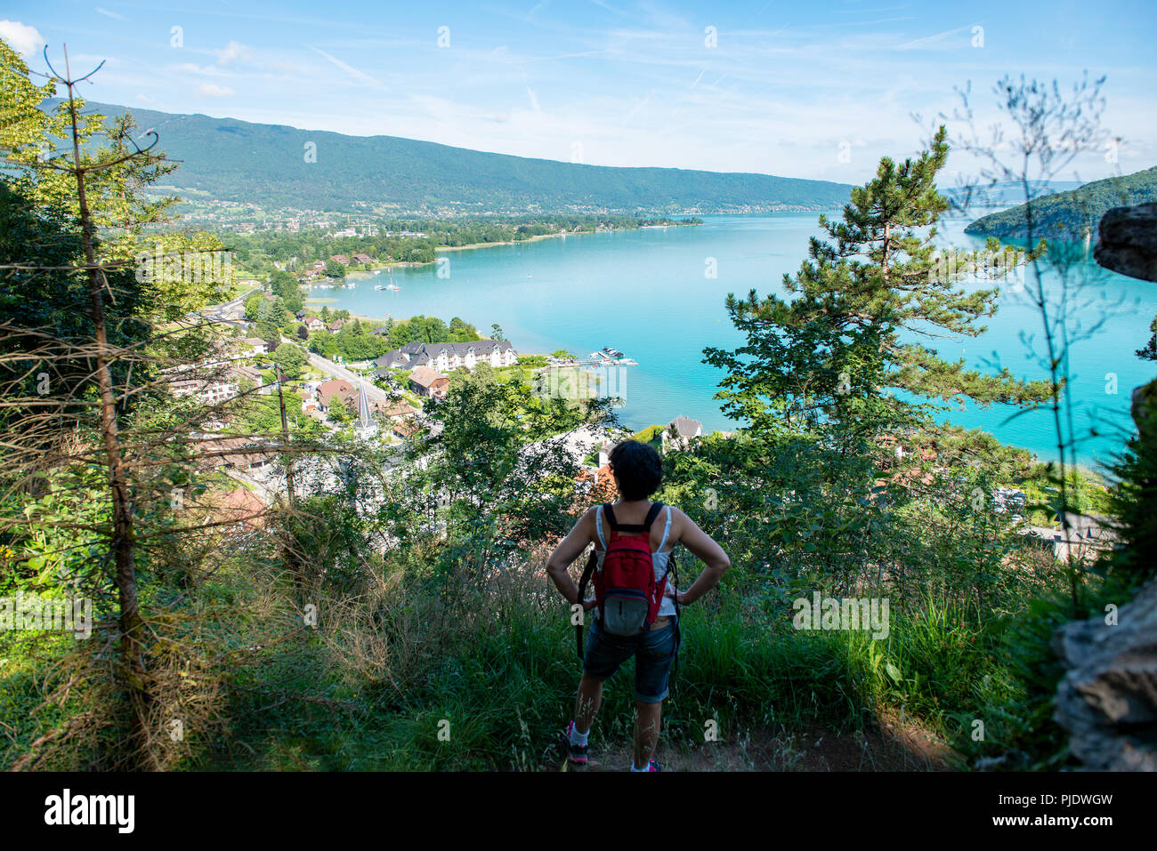 hiker woman looking at lake of Annecy in the french alps Stock Photo ...