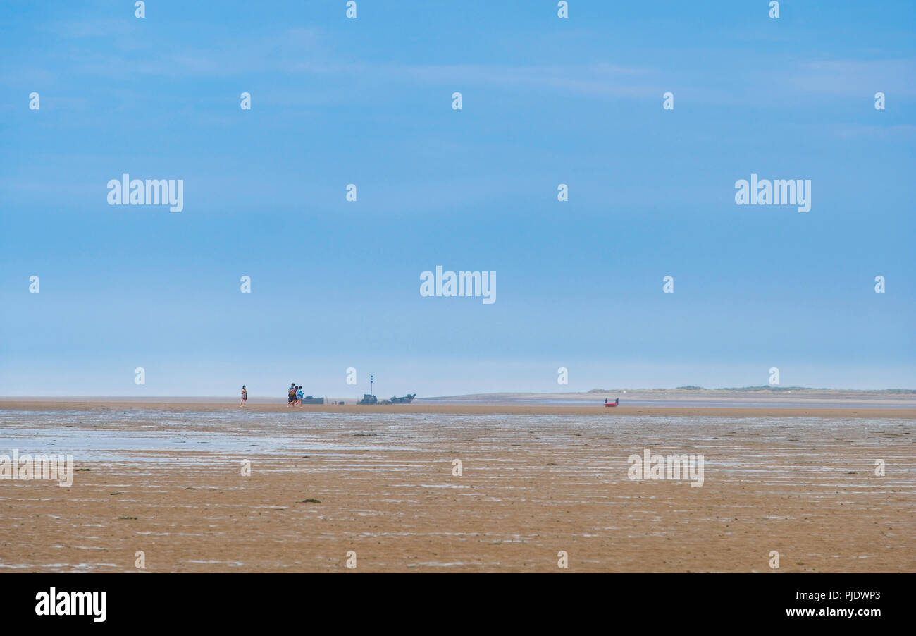 Enjoying the wide open sapce of Brancaster beach with the wreck in the ...