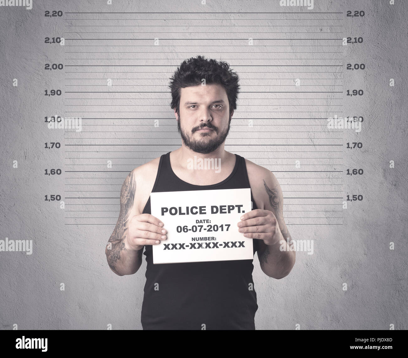 Caught gangster in jail with table on his hand Stock Photo - Alamy