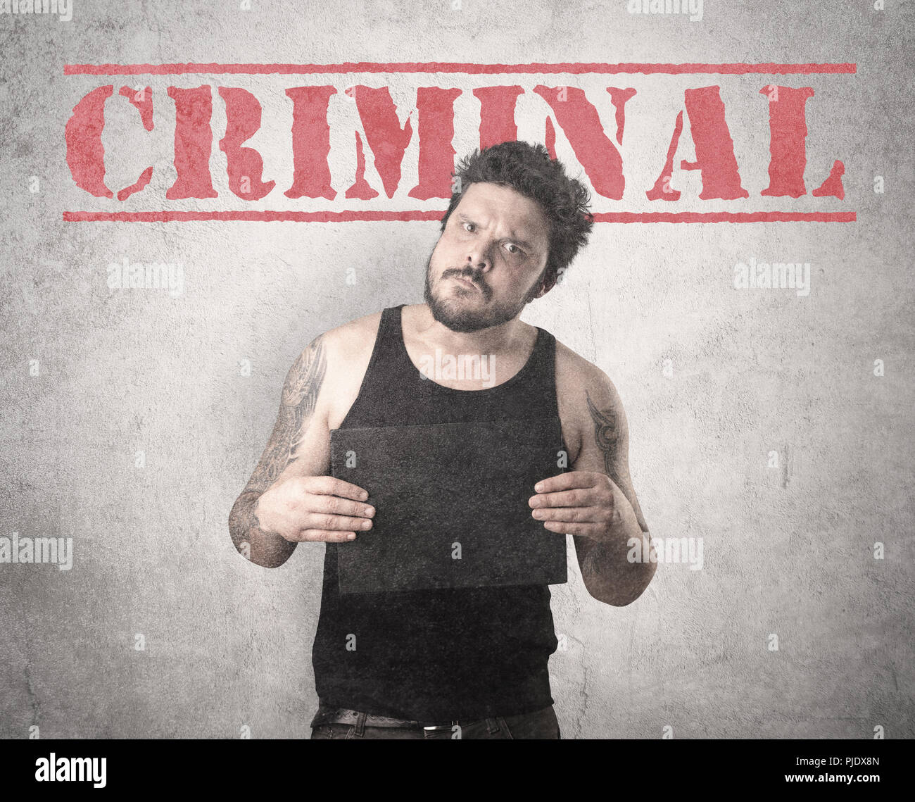Caught gangster with criminal background Stock Photo - Alamy