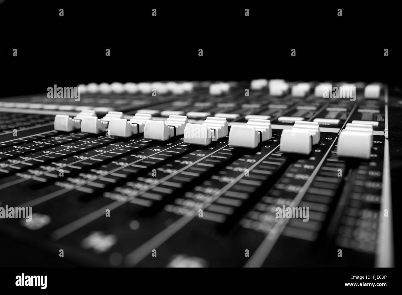 Wide angle closeup of Pro Audio Digital Mixing Console. White Faders ...