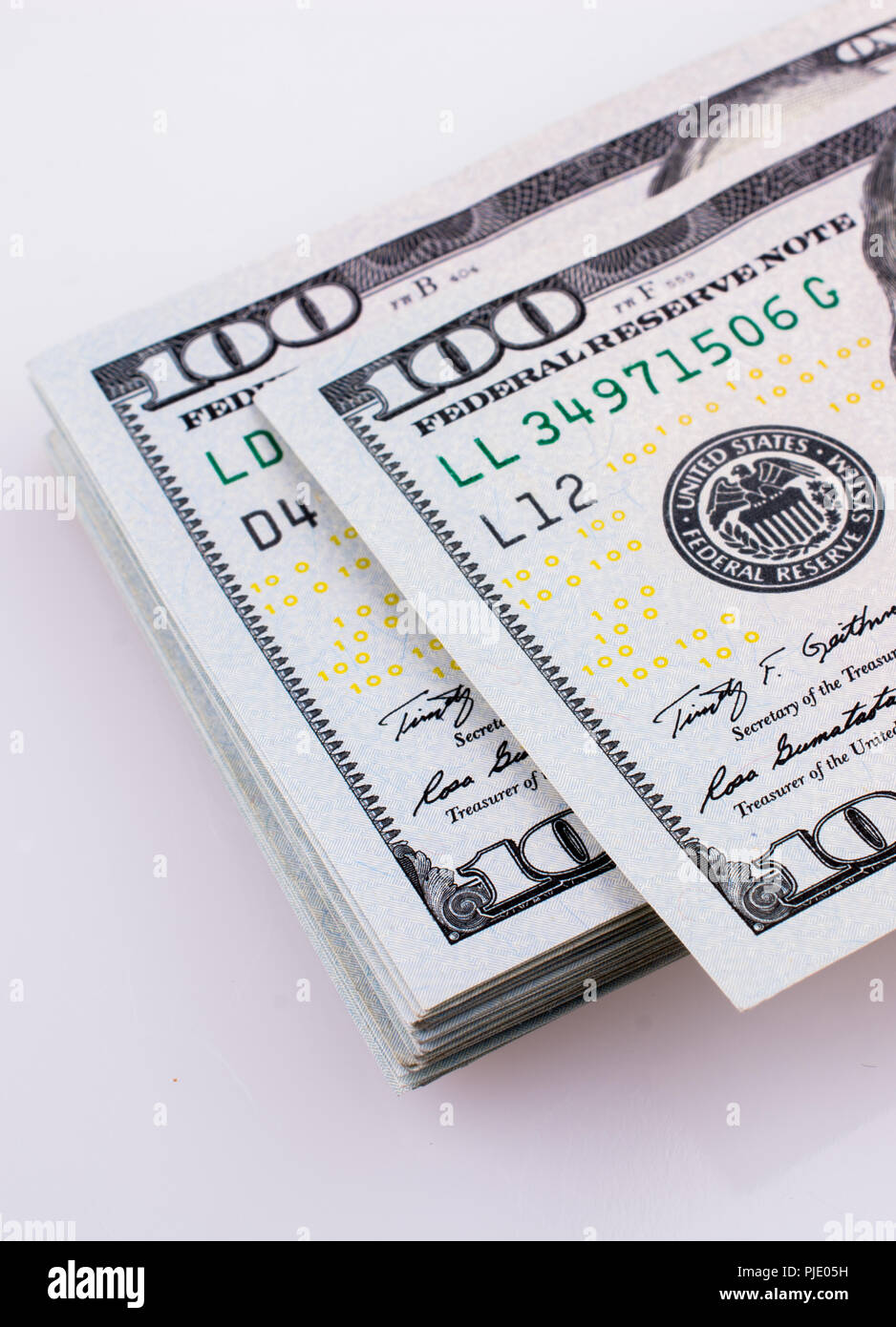 American 100 dollar banknotes made of paper placed on white background ...