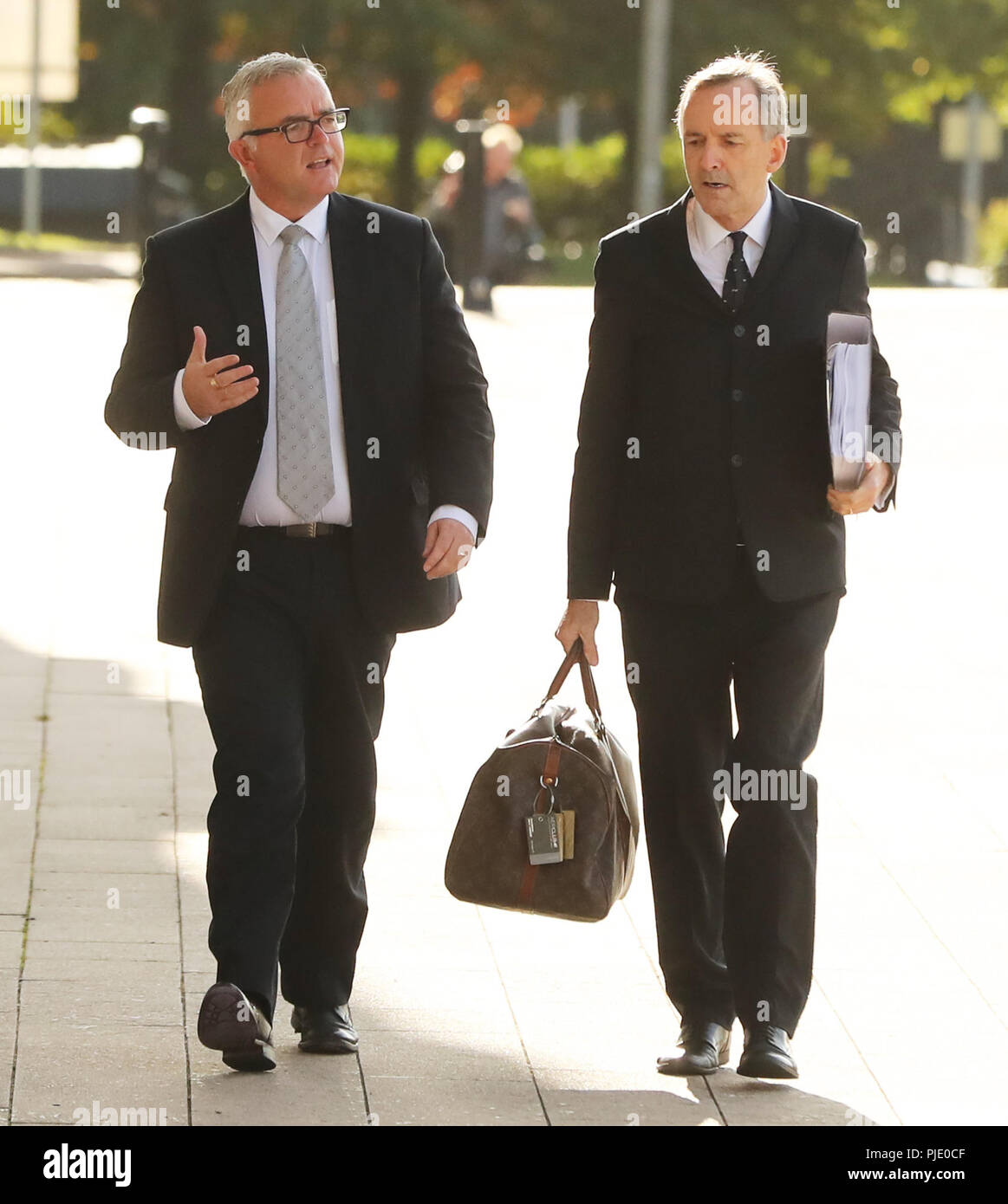 Former DUP minister Jonathan Bell (left) and his solicitor Denis ...