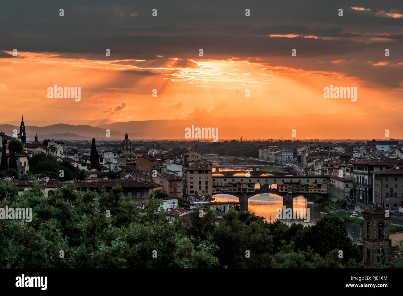 Romantic sunset view of Ponte Vecchio from Piazzale Michelangelo in the ...