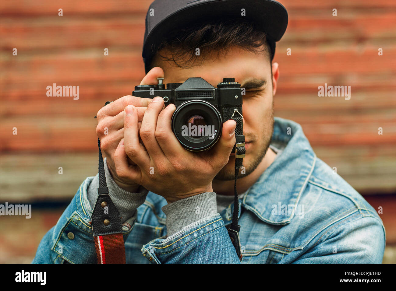 Hipster Photographer with camera Stock Photo - Alamy