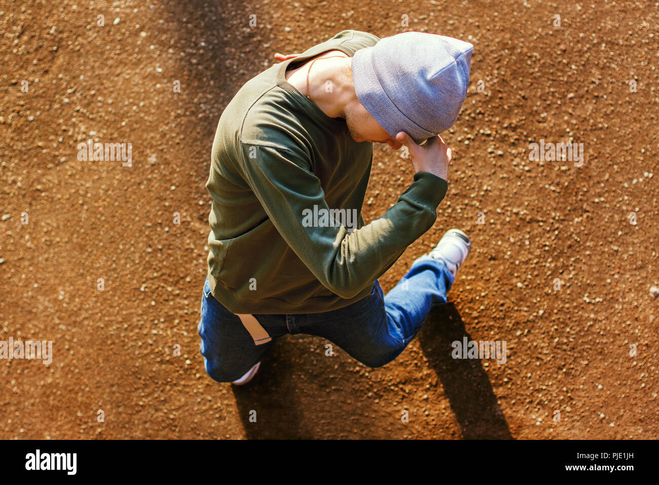 Dancer man covers face his hand Stock Photo - Alamy